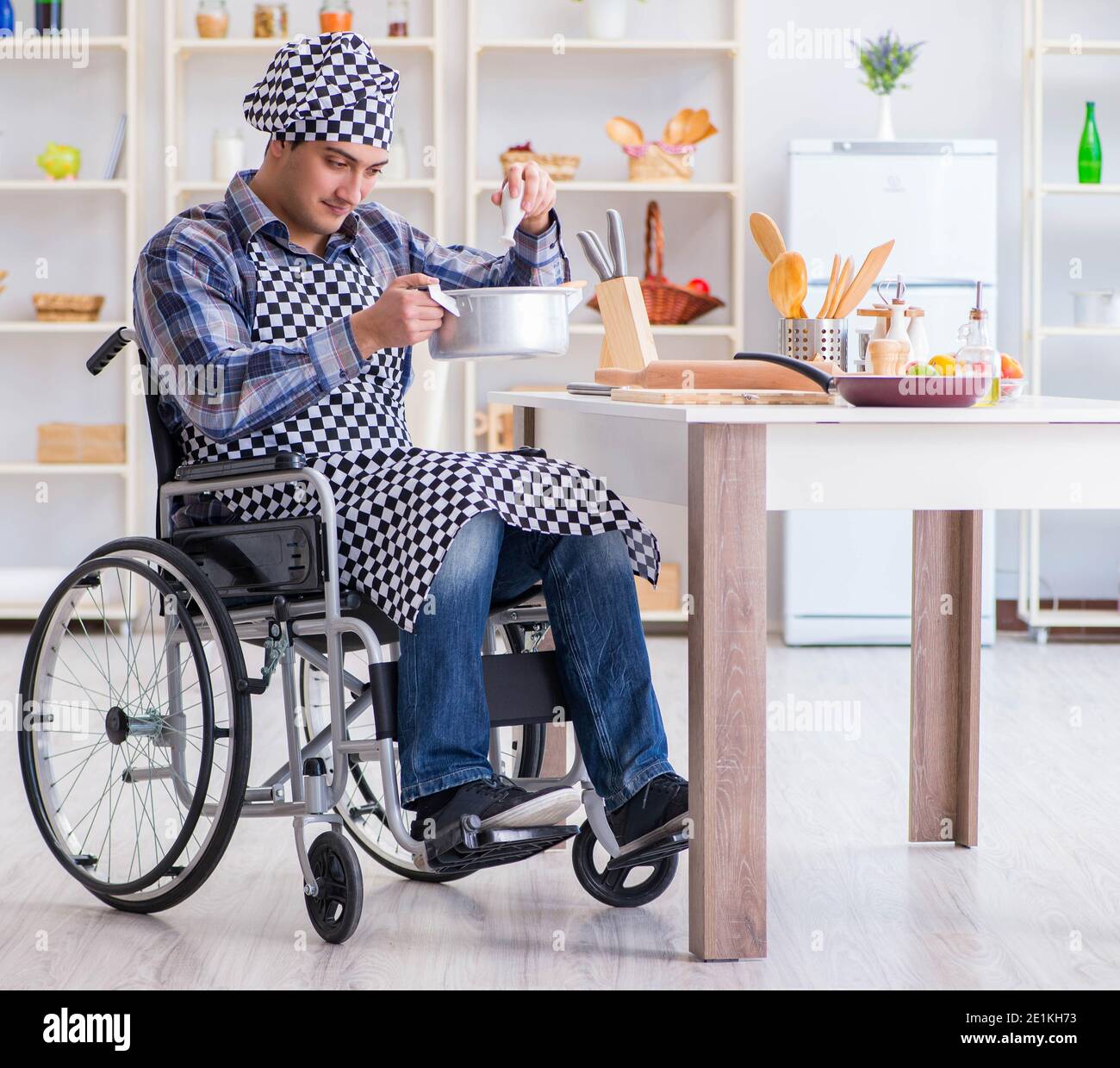 The disabled man preparing soup at kitchen Stock Photo - Alamy