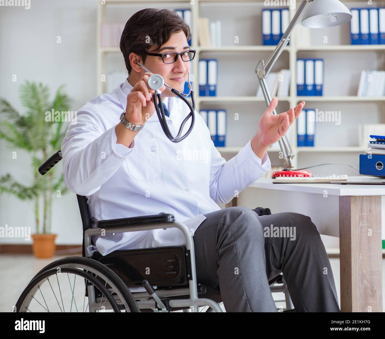 The disabled doctor on wheelchair working in hospital Stock Photo - Alamy