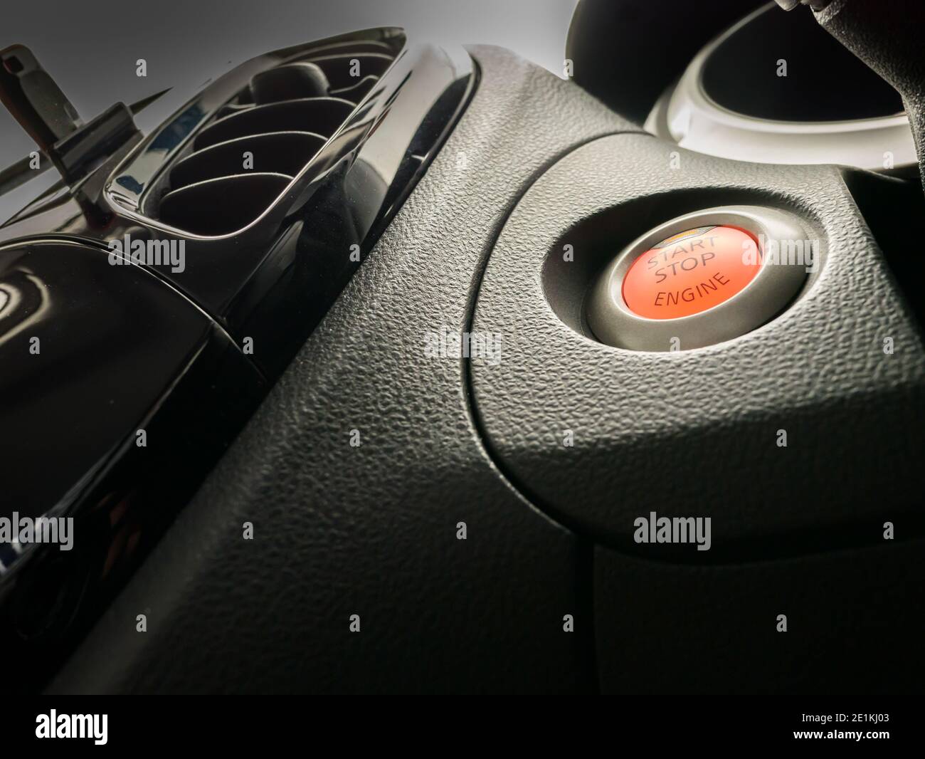 Orange color of push button start of engine automobile Stock Photo - Alamy