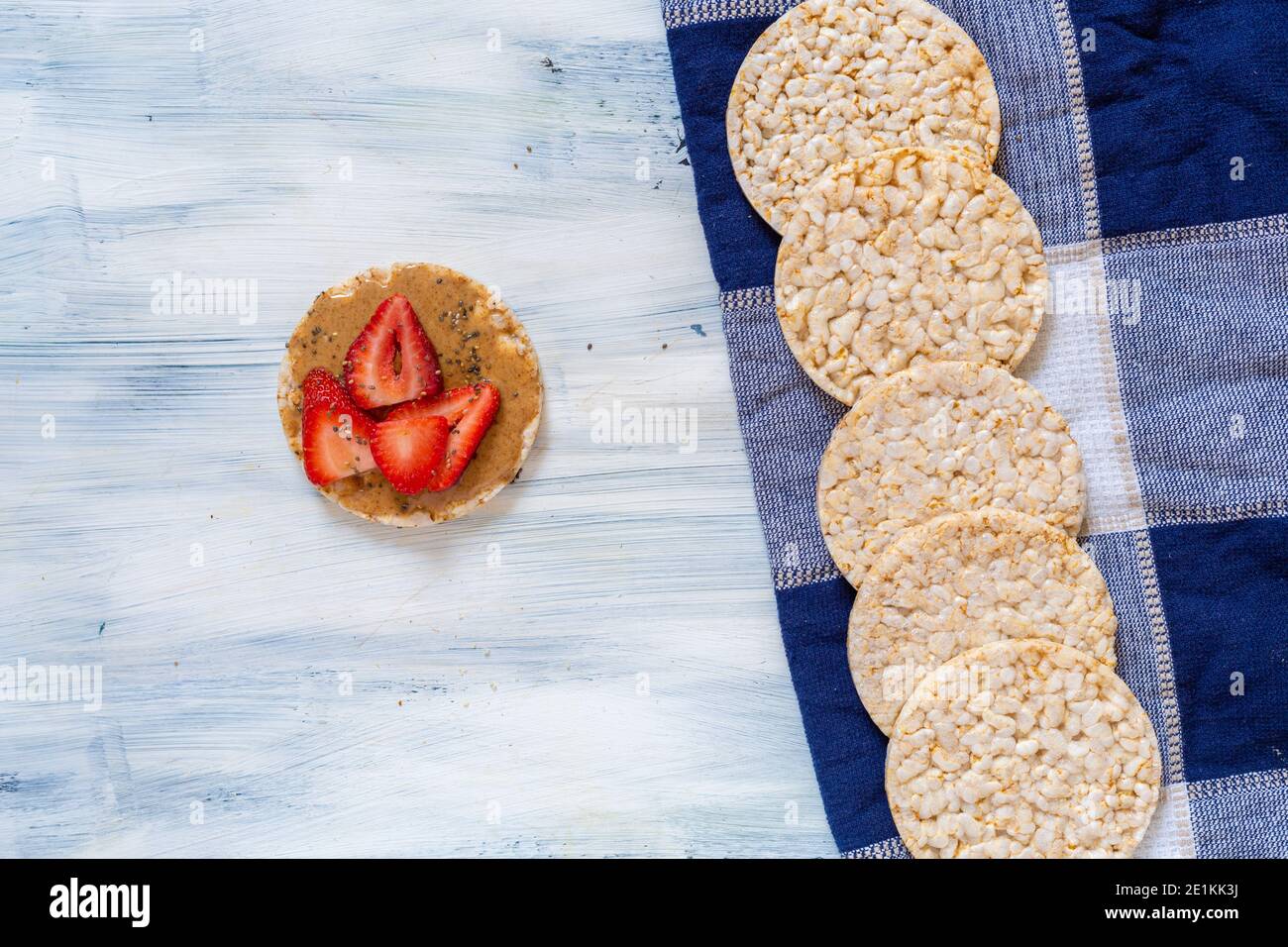 rice crackers, whit fruits on table blue, super food Stock Photo - Alamy