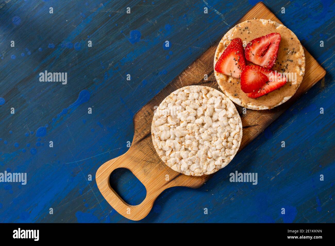 rice crackers, whit fruits on table blue, super food Stock Photo - Alamy