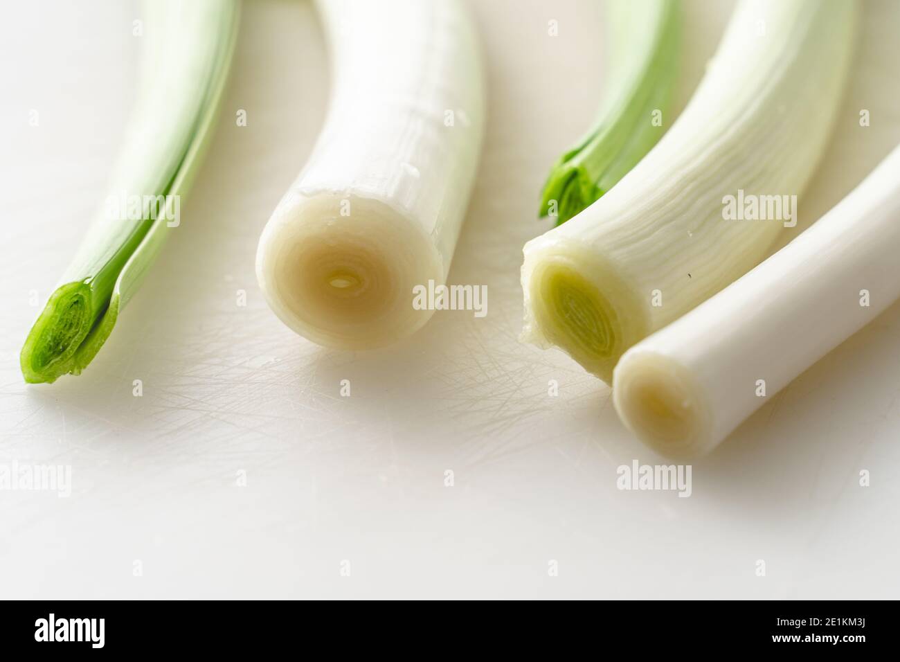 Allium porrum fresh organic Leek on the kitchen cutting table close up ...