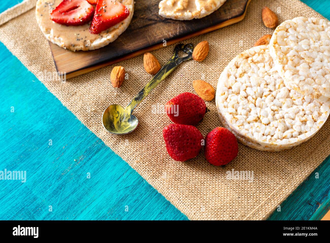 rice crackers, whit fruits on table blue, super food Stock Photo - Alamy