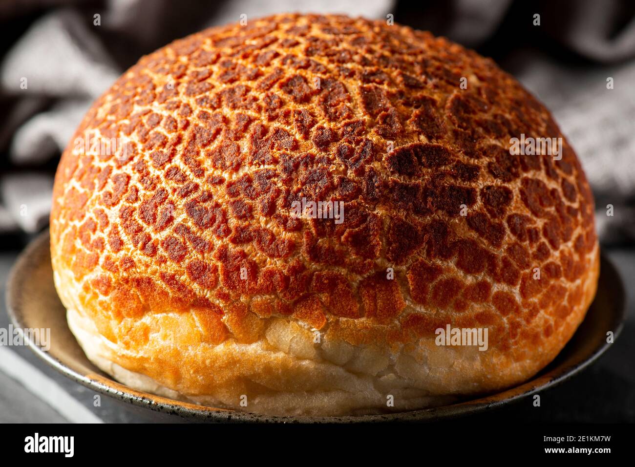 Fresh baked Tiger Bread roll also known as Dutch Crunch Stock Photo - Alamy