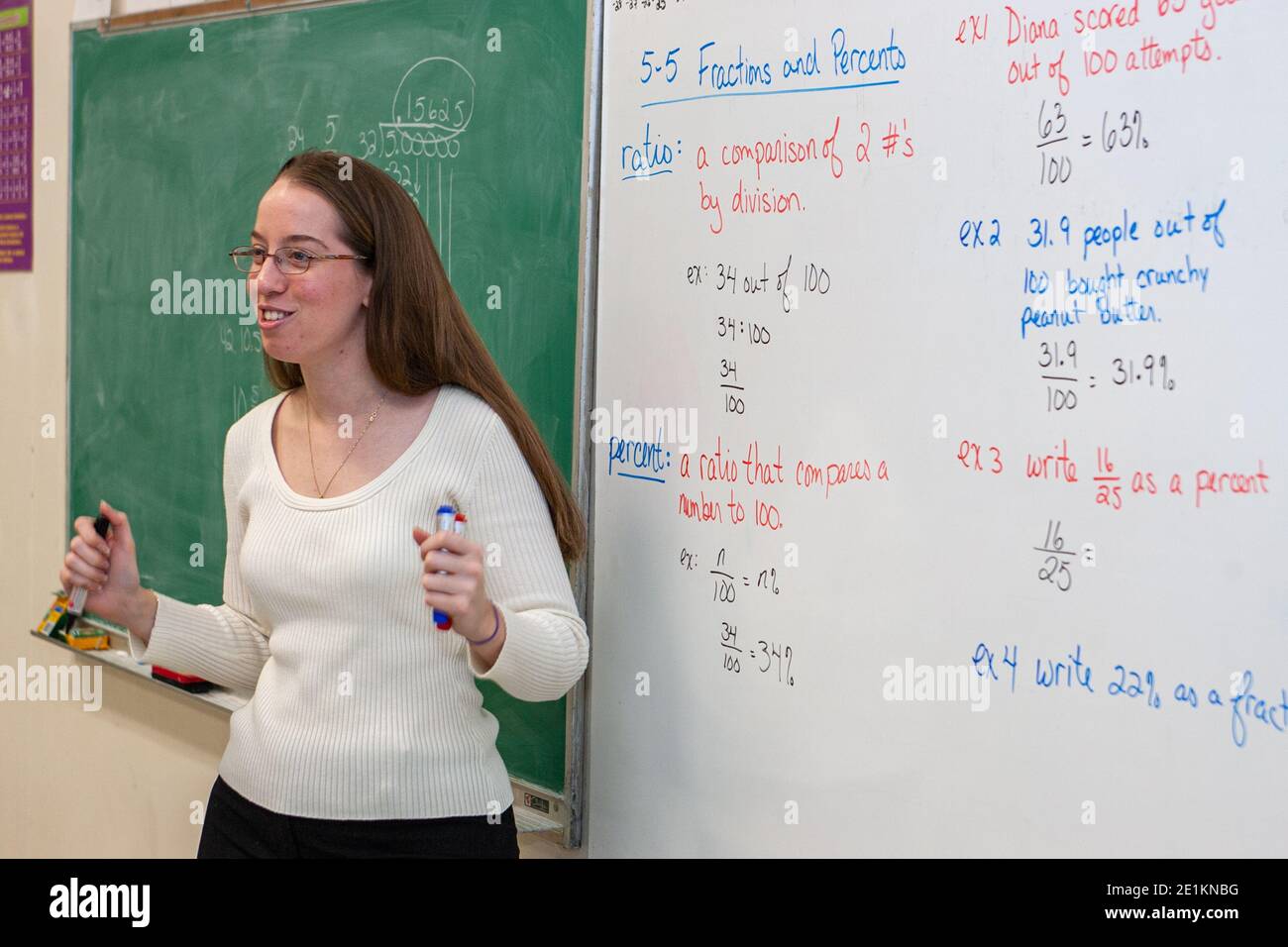 Math teacher teaching in the classroom Stock Photo - Alamy