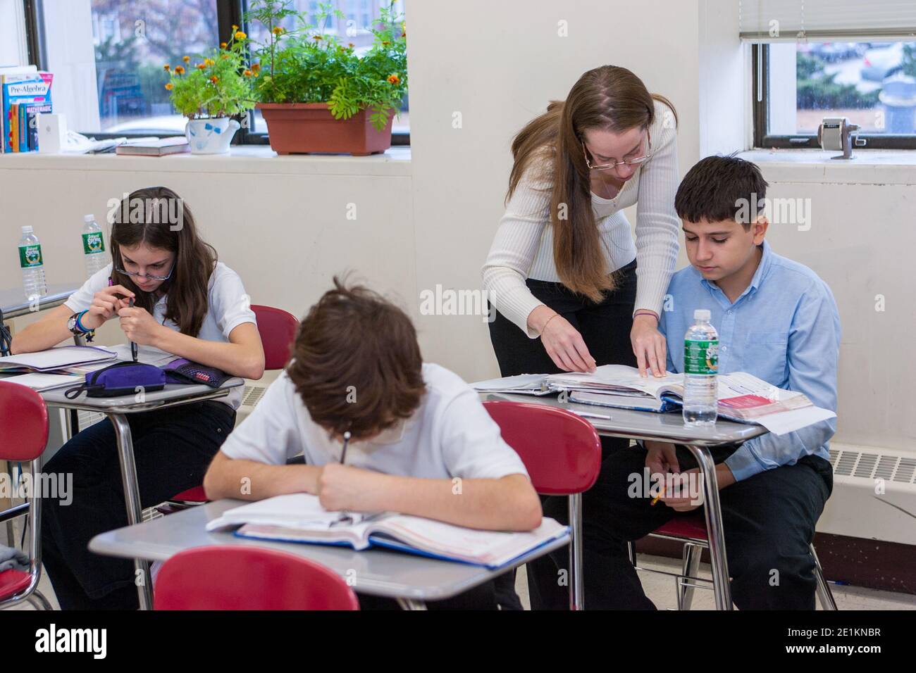 Math teacher teaching in the classroom Stock Photo - Alamy