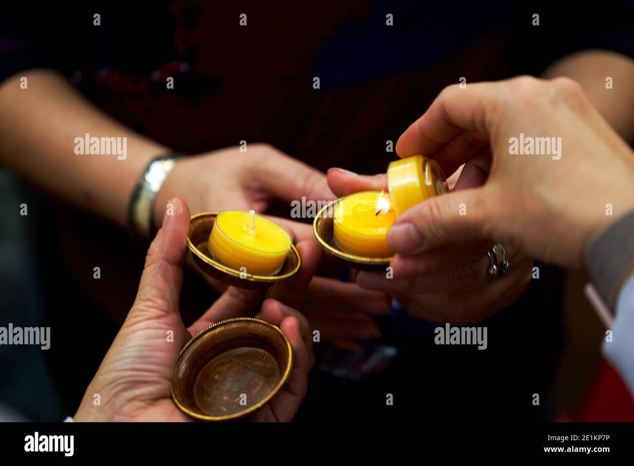 People holding small candle holders in the blessing Stock Photo - Alamy
