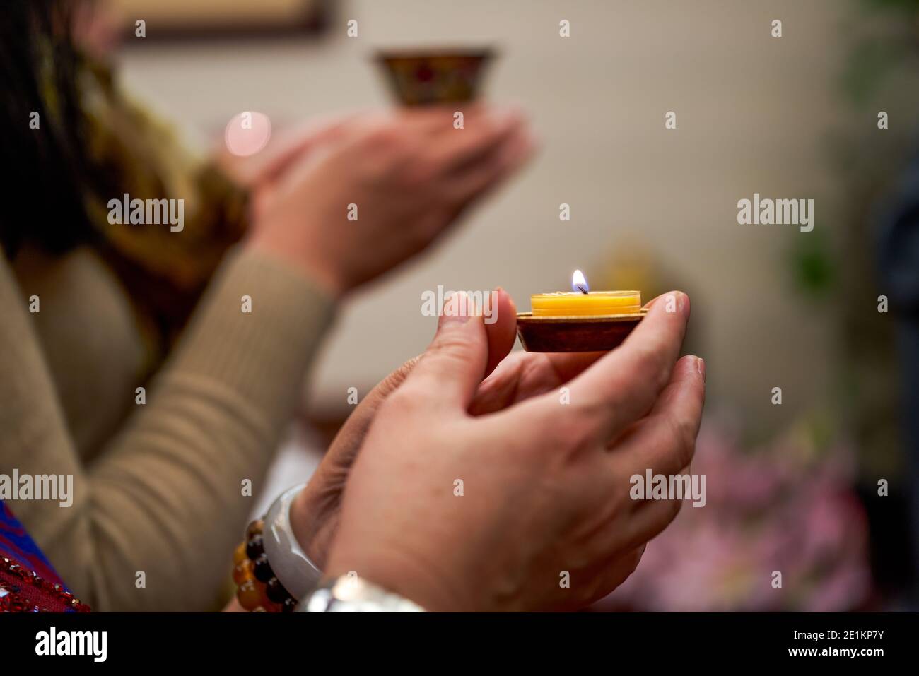 People holding small candle holders in the blessing Stock Photo - Alamy