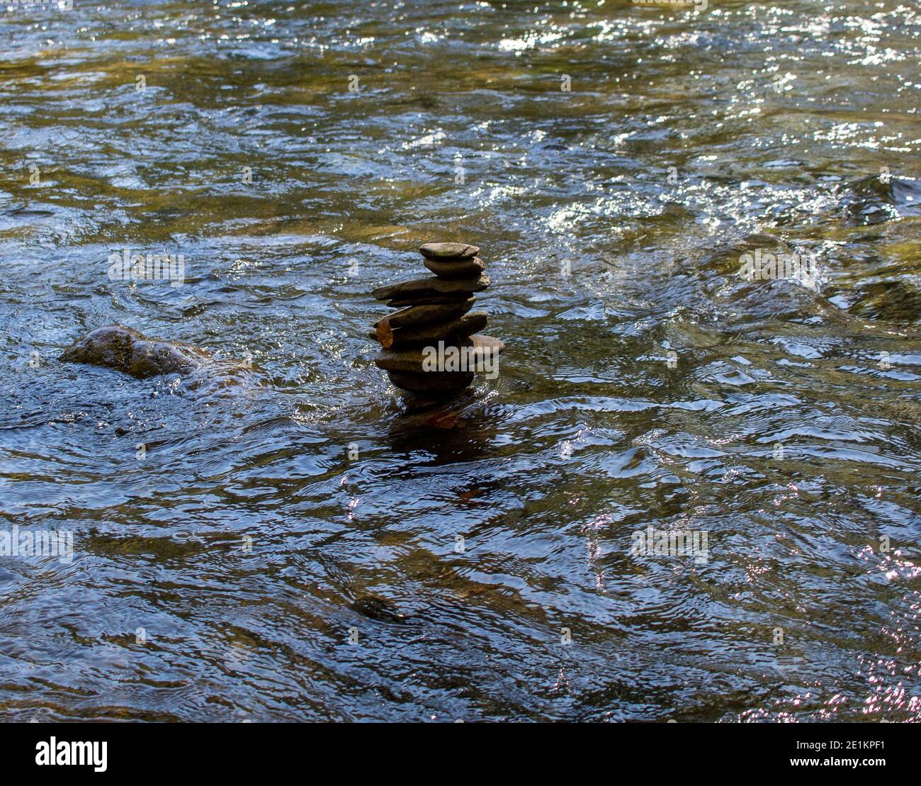 Stones in a stream Stock Photo - Alamy