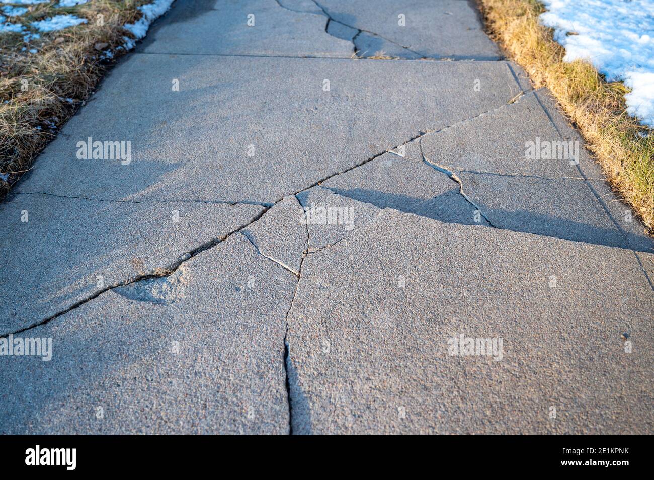 damaged concrete slabs caused by soil structure heave Stock Photo - Alamy