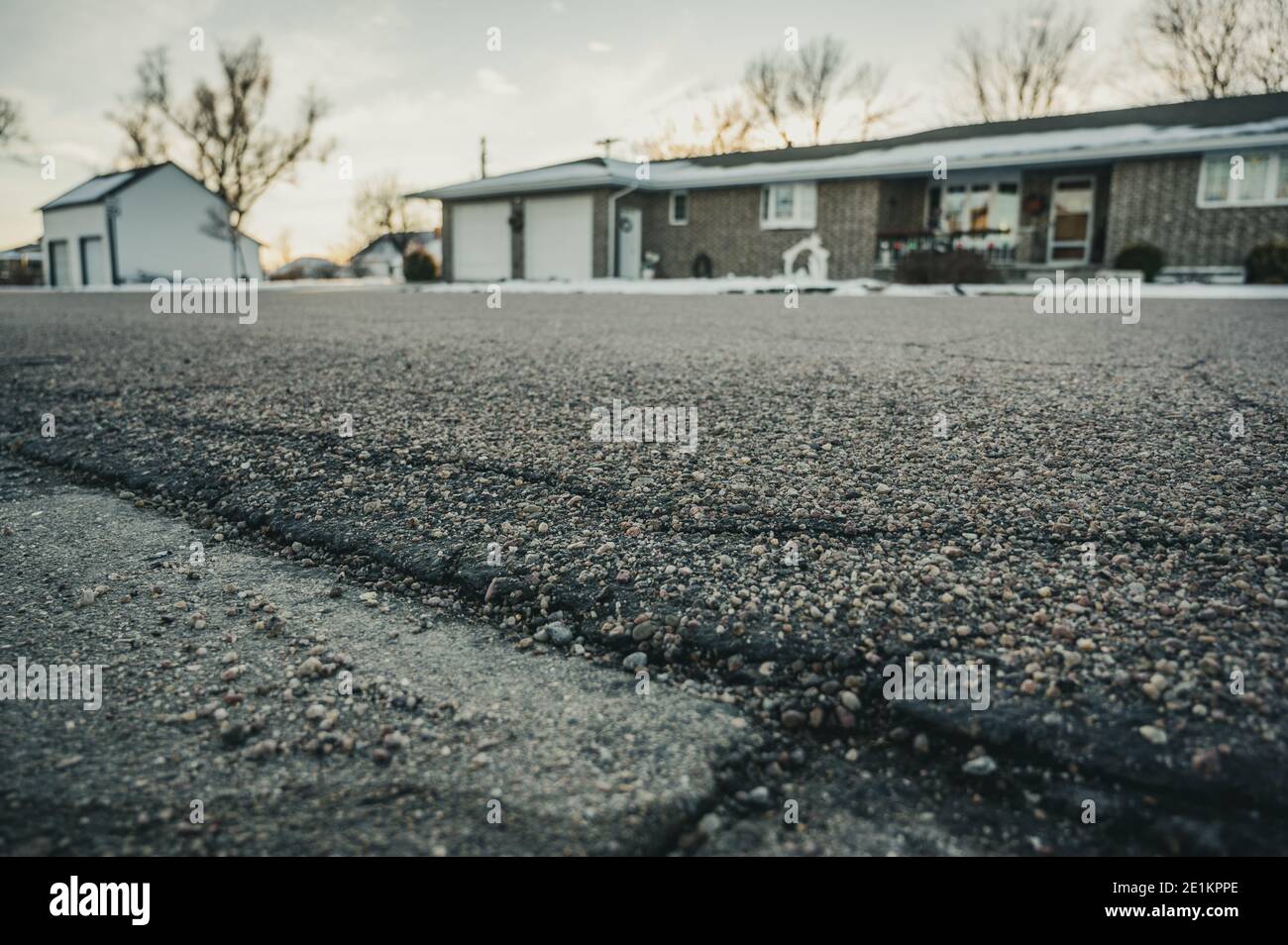 Method of applying an asphalt layer on top of an existing concrete ...