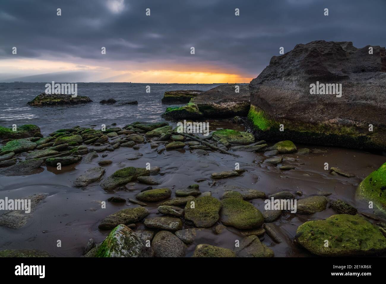 Gloomy sunrise on the seaside Stock Photo - Alamy