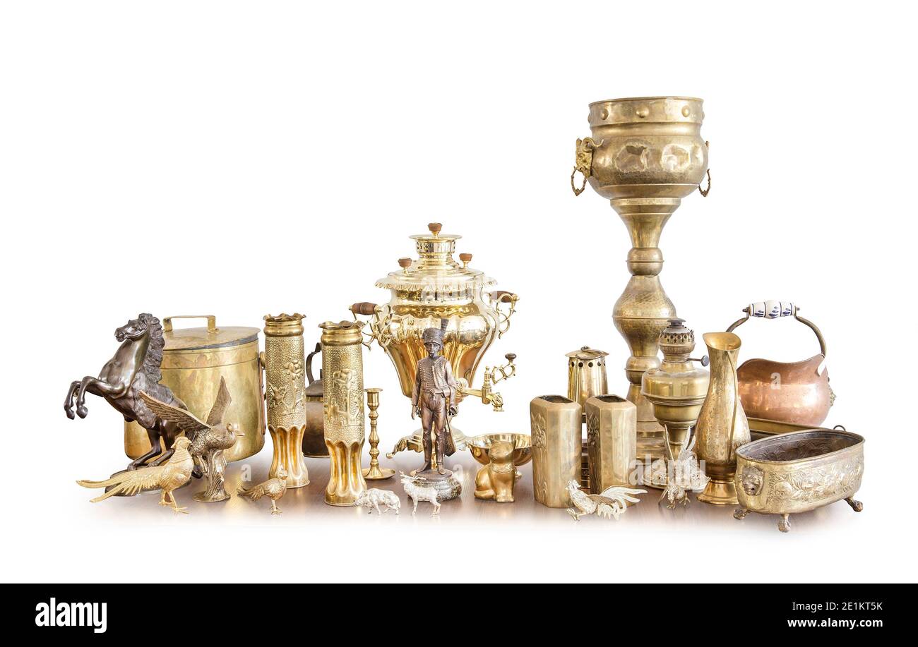 Collection of antique copper cookware displayed on the white background ...