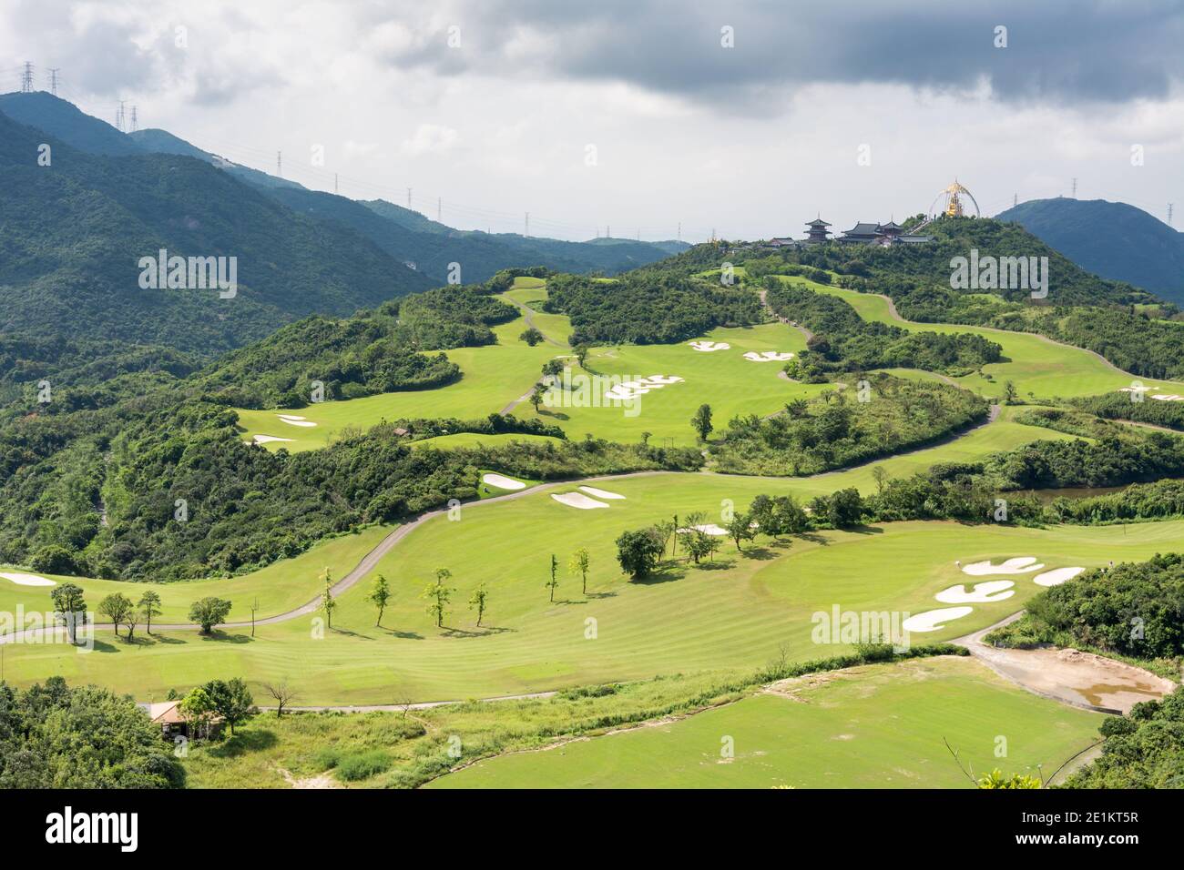 Green golf field on the hills in Overseas Chinese Town East (OCT East ...