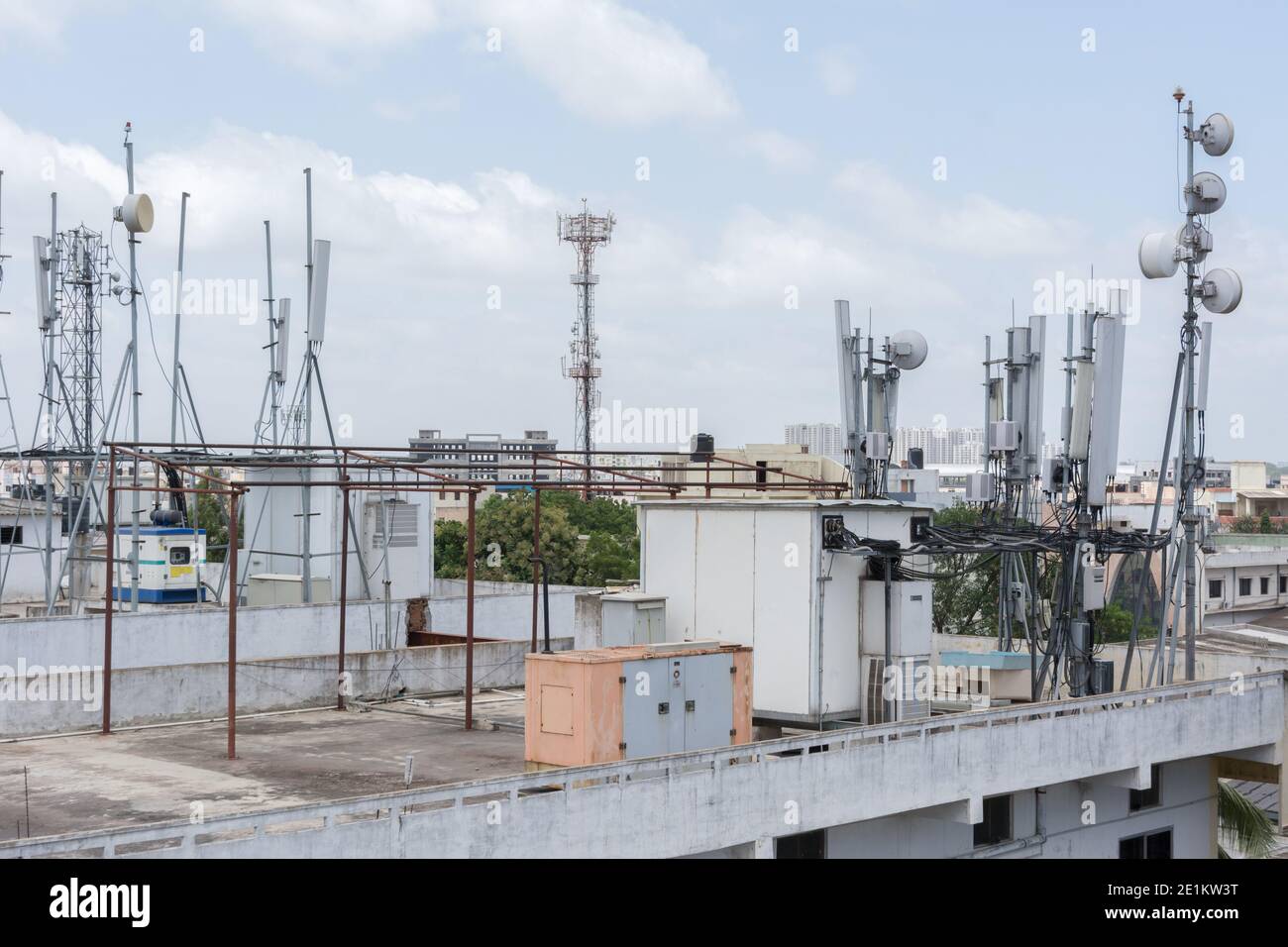 Telecommunication tower of 4G and 5G cellular base station on a roof of ...