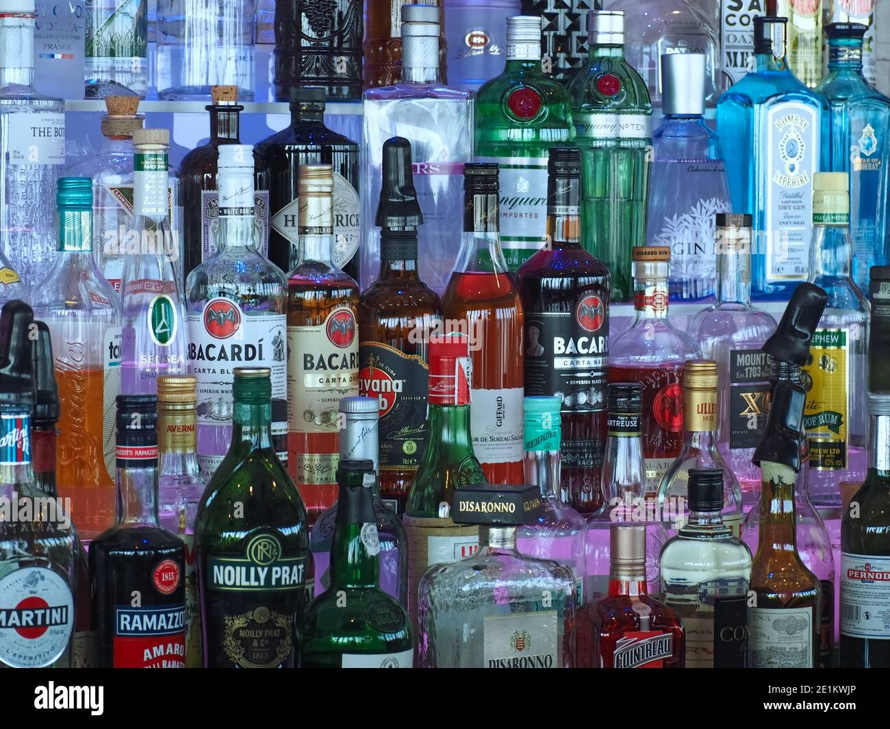 Many bottles of alcohol in a bar to create drinks Stock Photo - Alamy