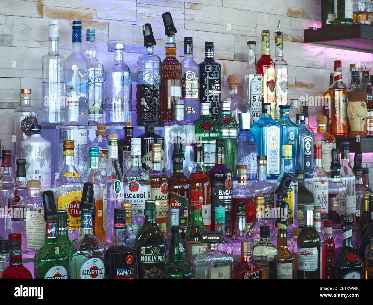 Many bottles of alcohol in a bar to create drinks Stock Photo - Alamy