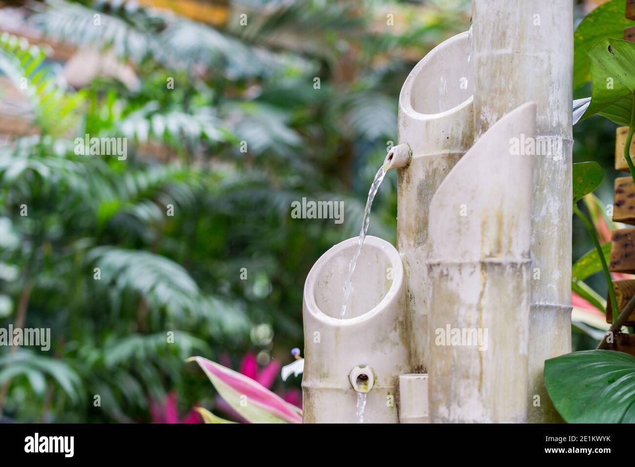 Water flowing in a small fountain of a chinese garden Stock Photo - Alamy