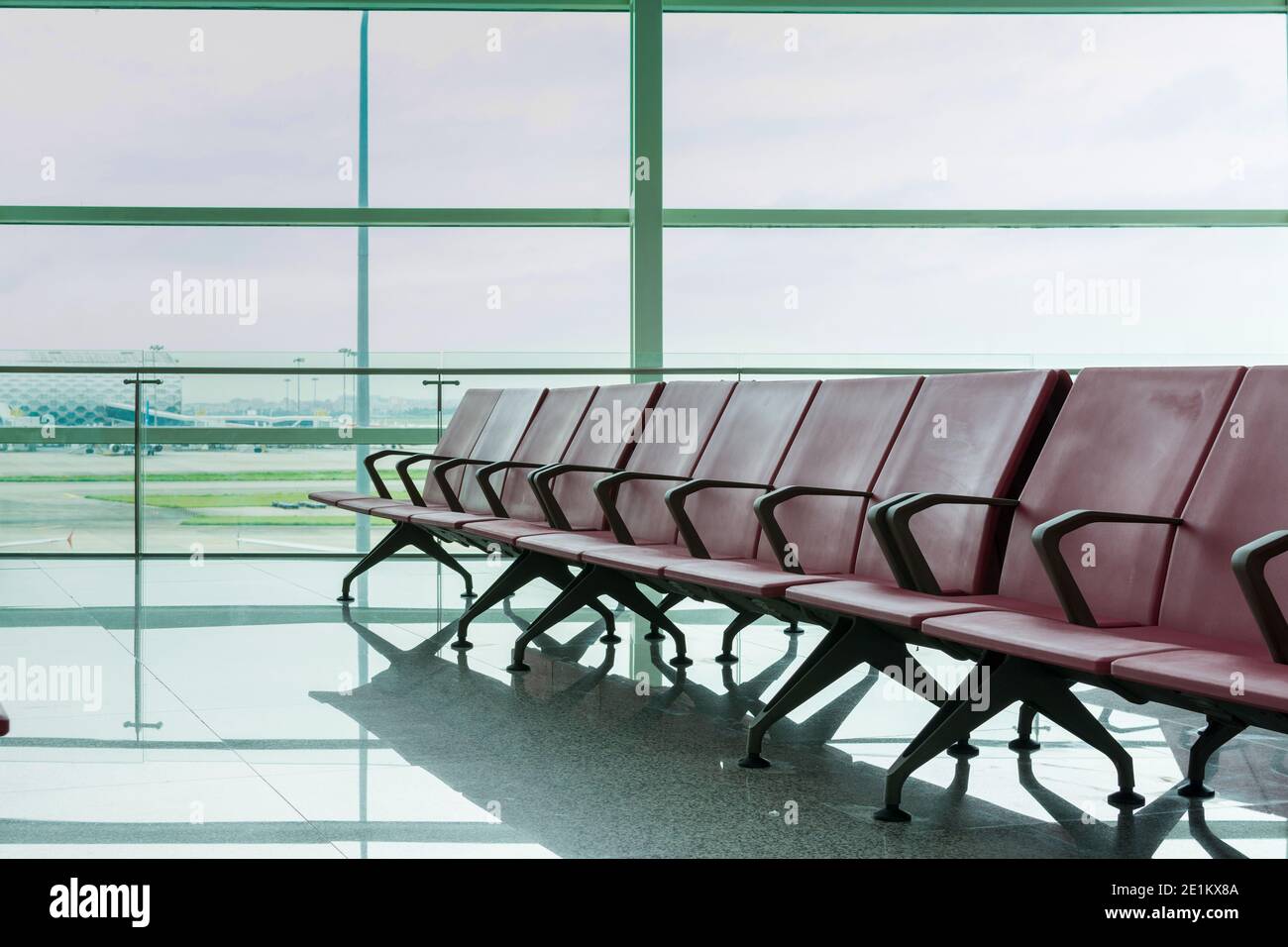 Chairs at the terminal of airport Stock Photo - Alamy