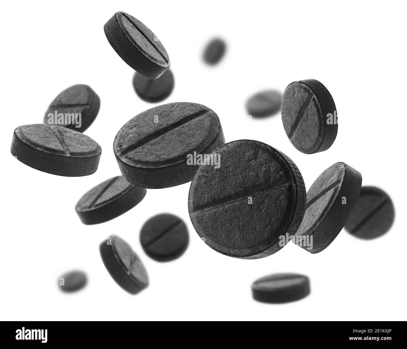 Black activated carbon tablets levitate on a white background Stock ...