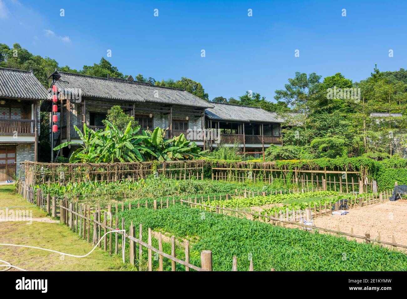 A old typical Chinese wooden Hakka's Gankeng house against blue sky ...