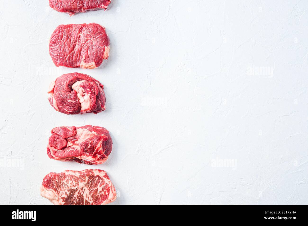 Raw set of alternative beef cuts Chuck eye roll, top blade, rump steak ...