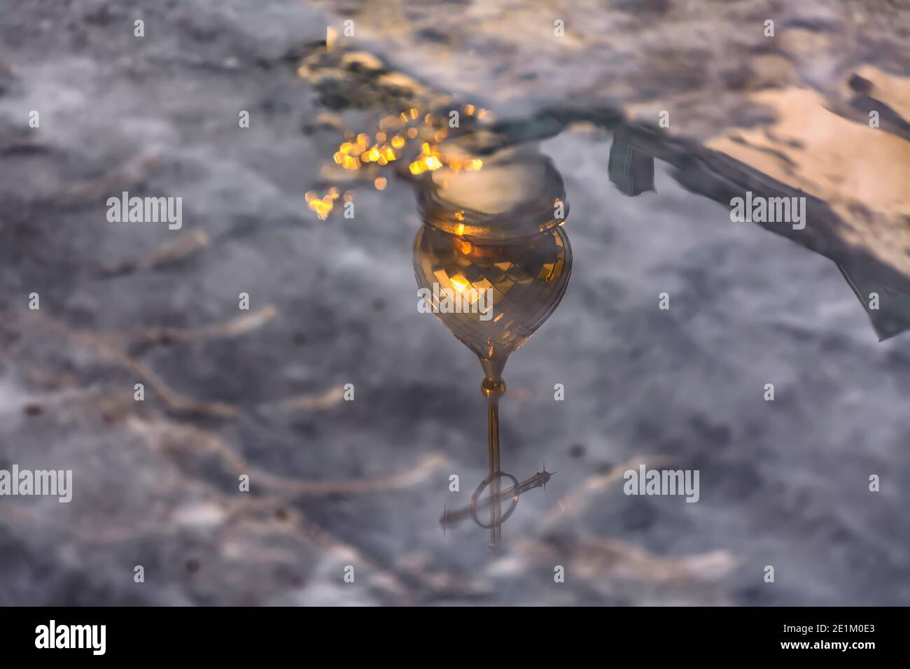 Reflection of the dome of the temple in the frozen melted snow Stock ...