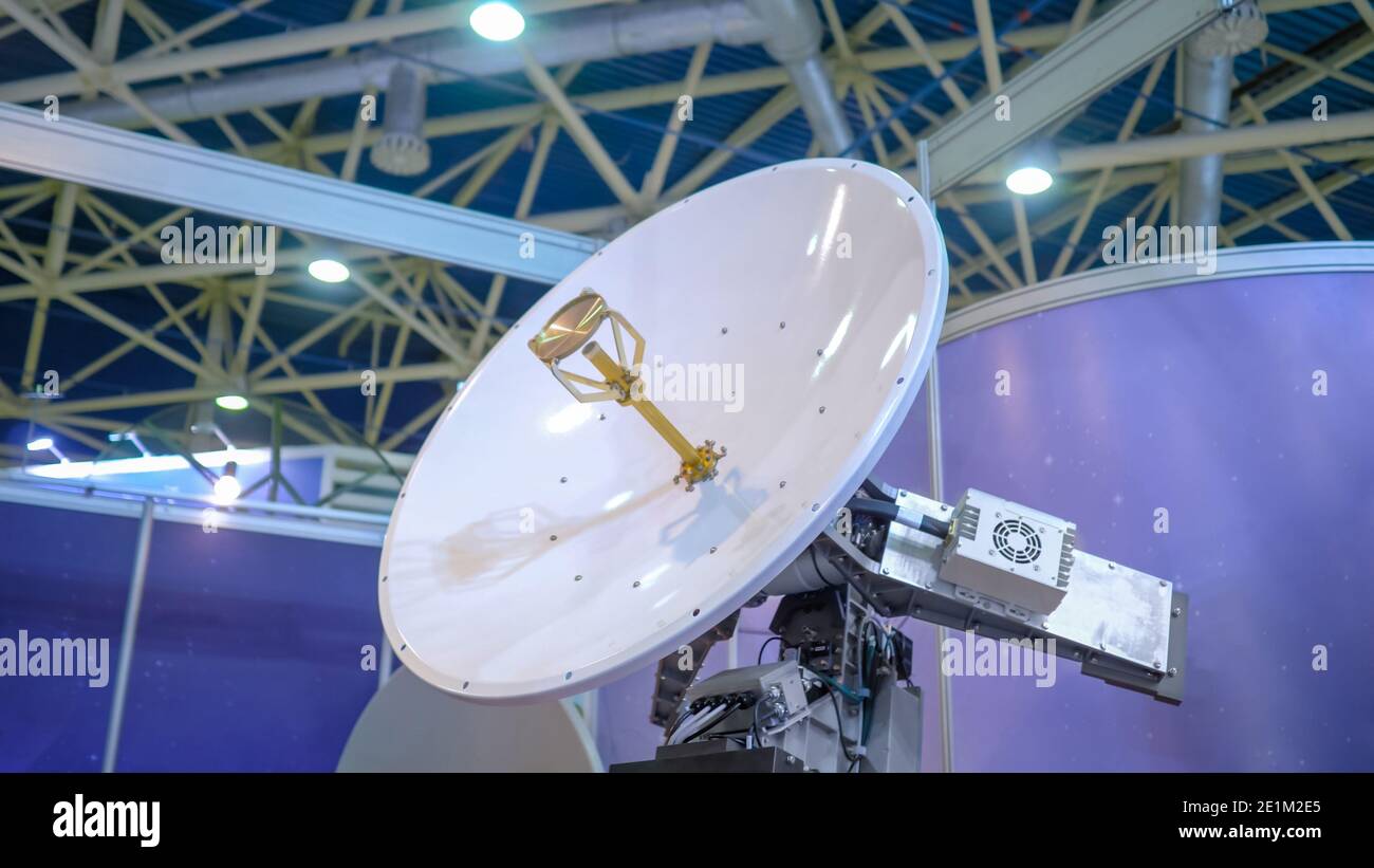 White rotating satellite dish antenna using to receive or transmit information Stock Photo - Alamy