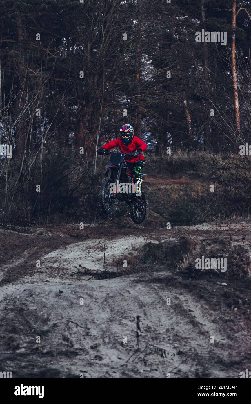 Dirt Bike Rider Jumps over hils with dirt bike Stock Photo - Alamy