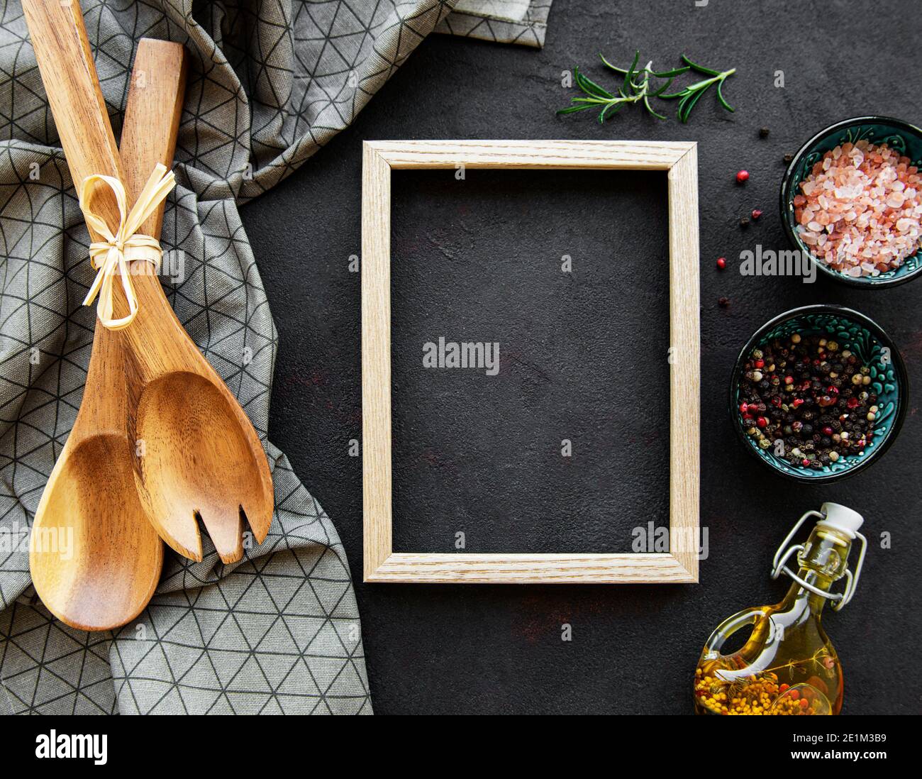 Old wooden kitchen utensils and spices with frame as a border on a ...