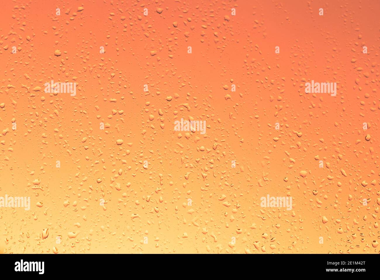 glass window background with raindrops, evening orange sunset, texture ...