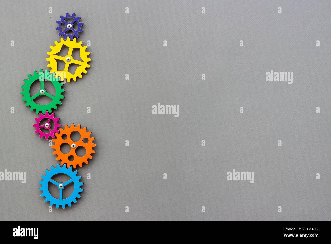Working gears connect into puzzle, top view. Teamwork and collaboration ...