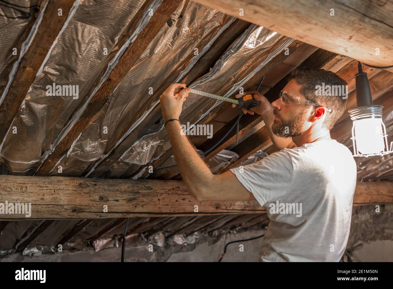 House roof insulation work Stock Photo - Alamy