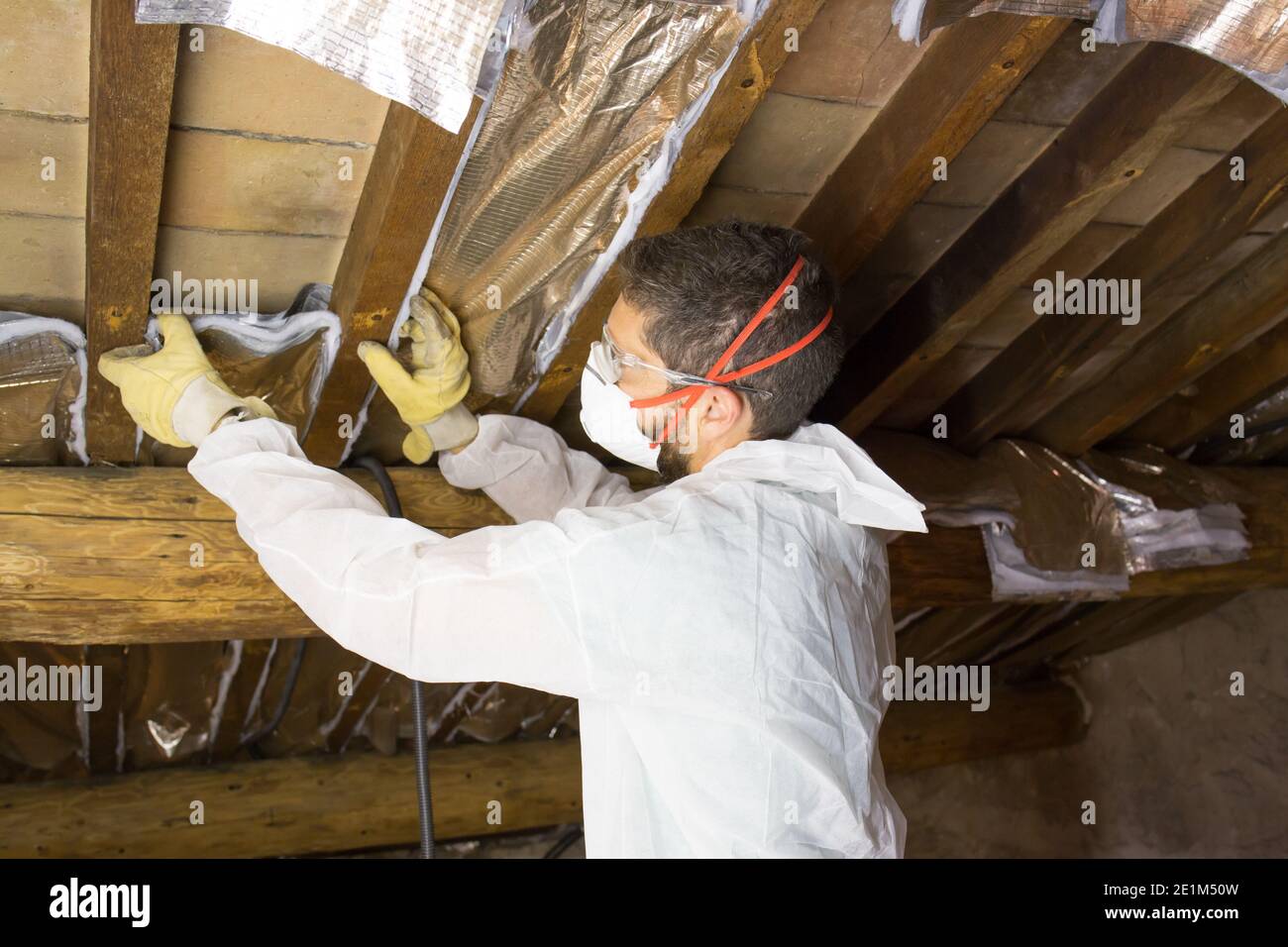House roof insulation work Stock Photo - Alamy