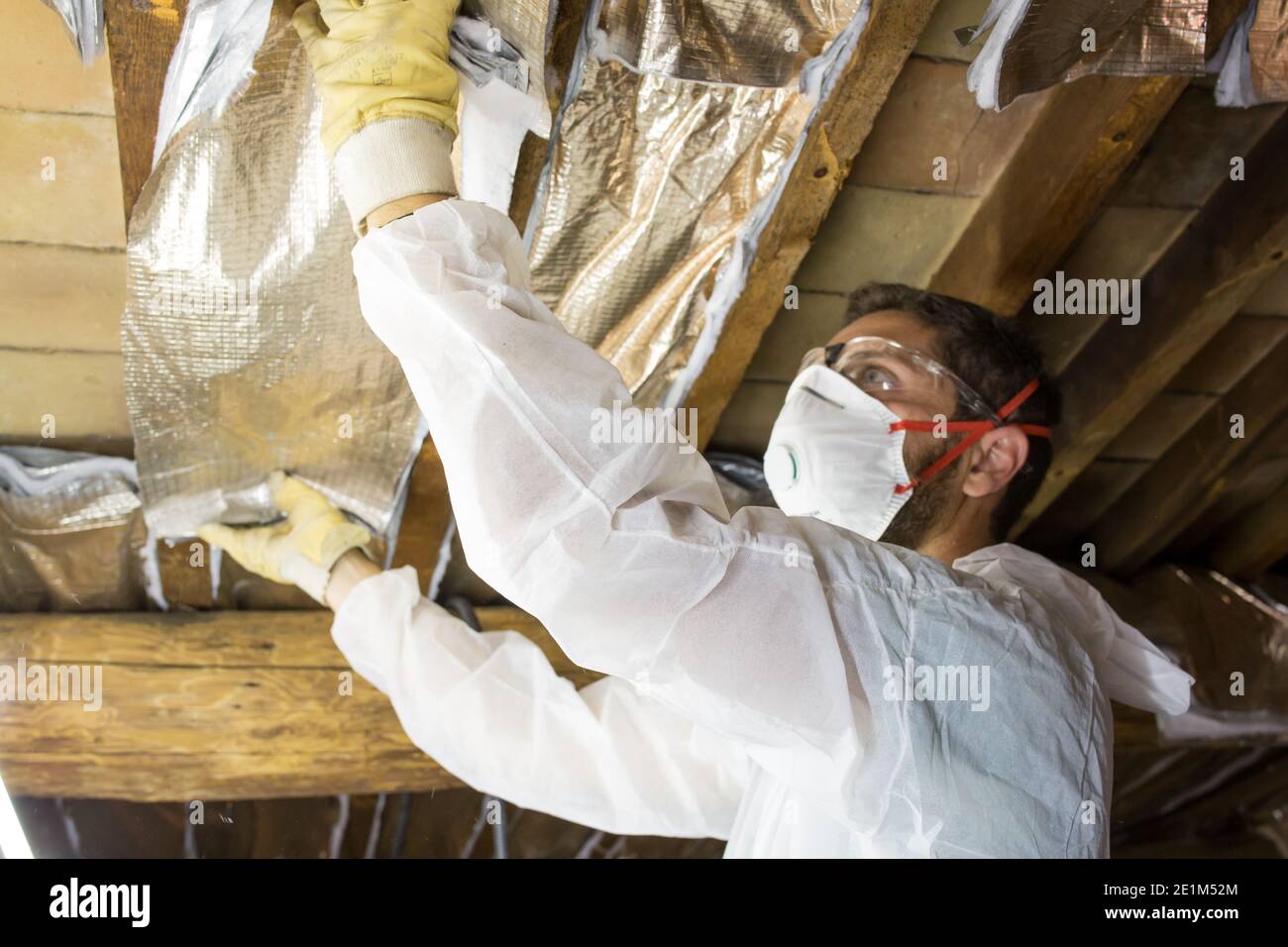 House roof insulation work Stock Photo - Alamy