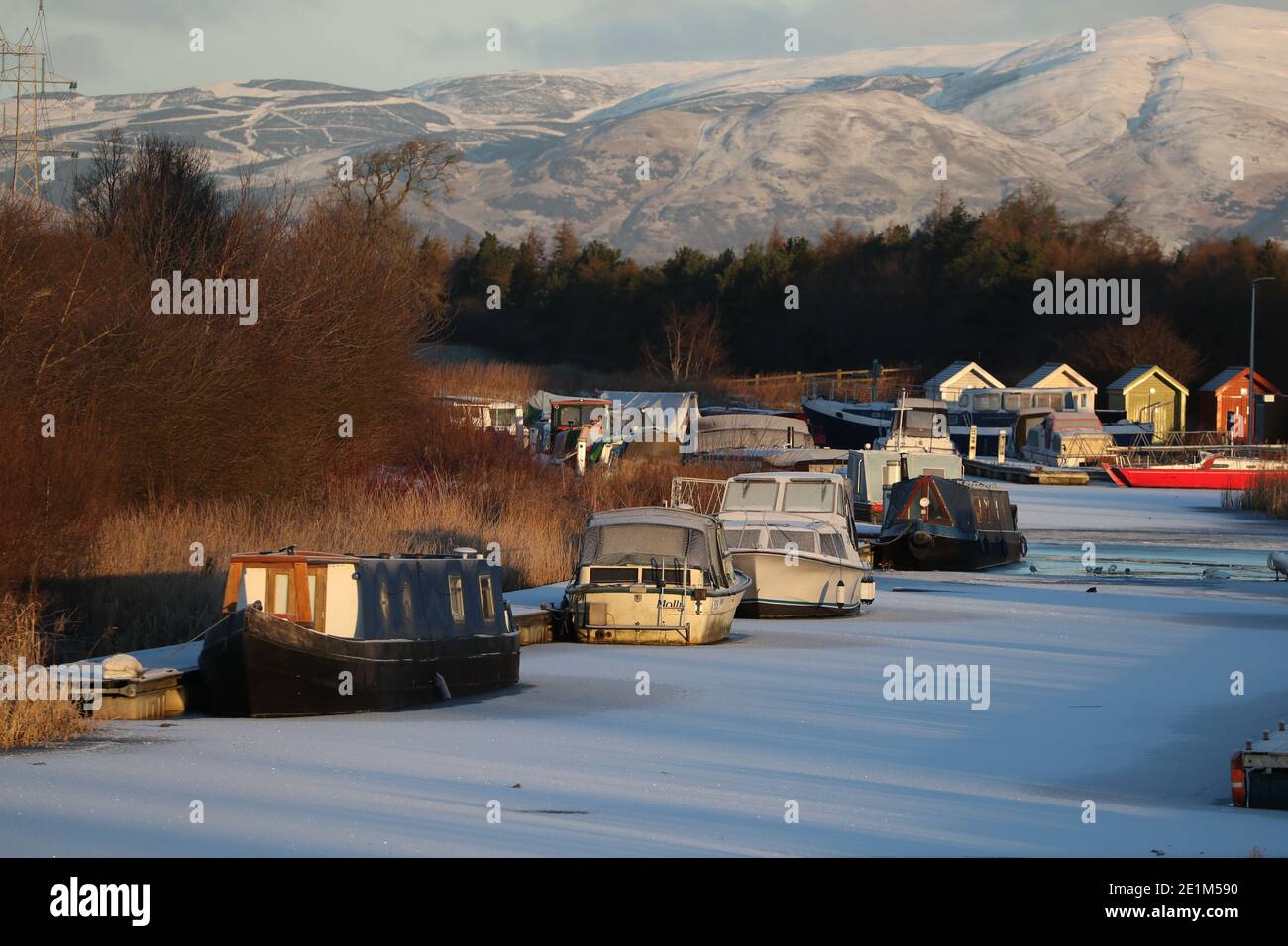 A frost and snow covered Forth and Clyde Canal near to the Kelpies in ...