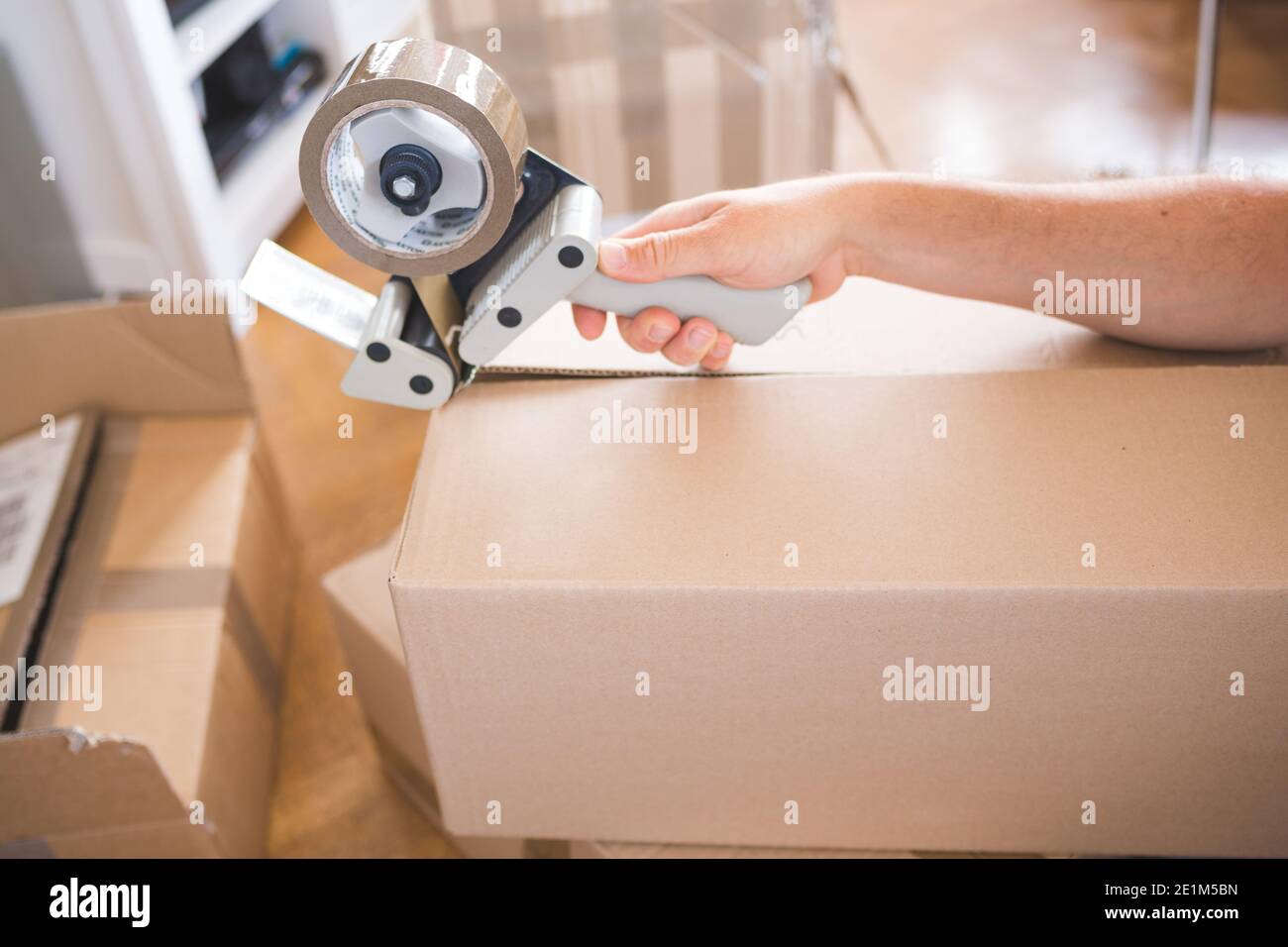 Man packing boxes hi-res stock photography and images - Alamy