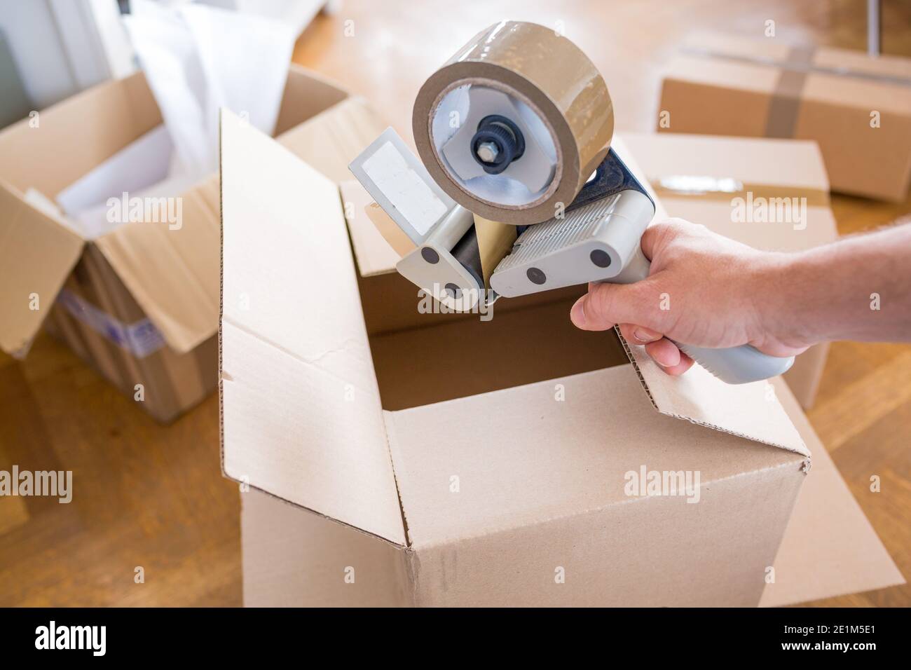 Man packing boxes hi-res stock photography and images - Alamy