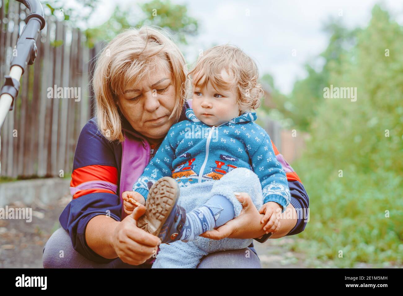 grandmother with a small grandson on a country plot Stock Photo - Alamy