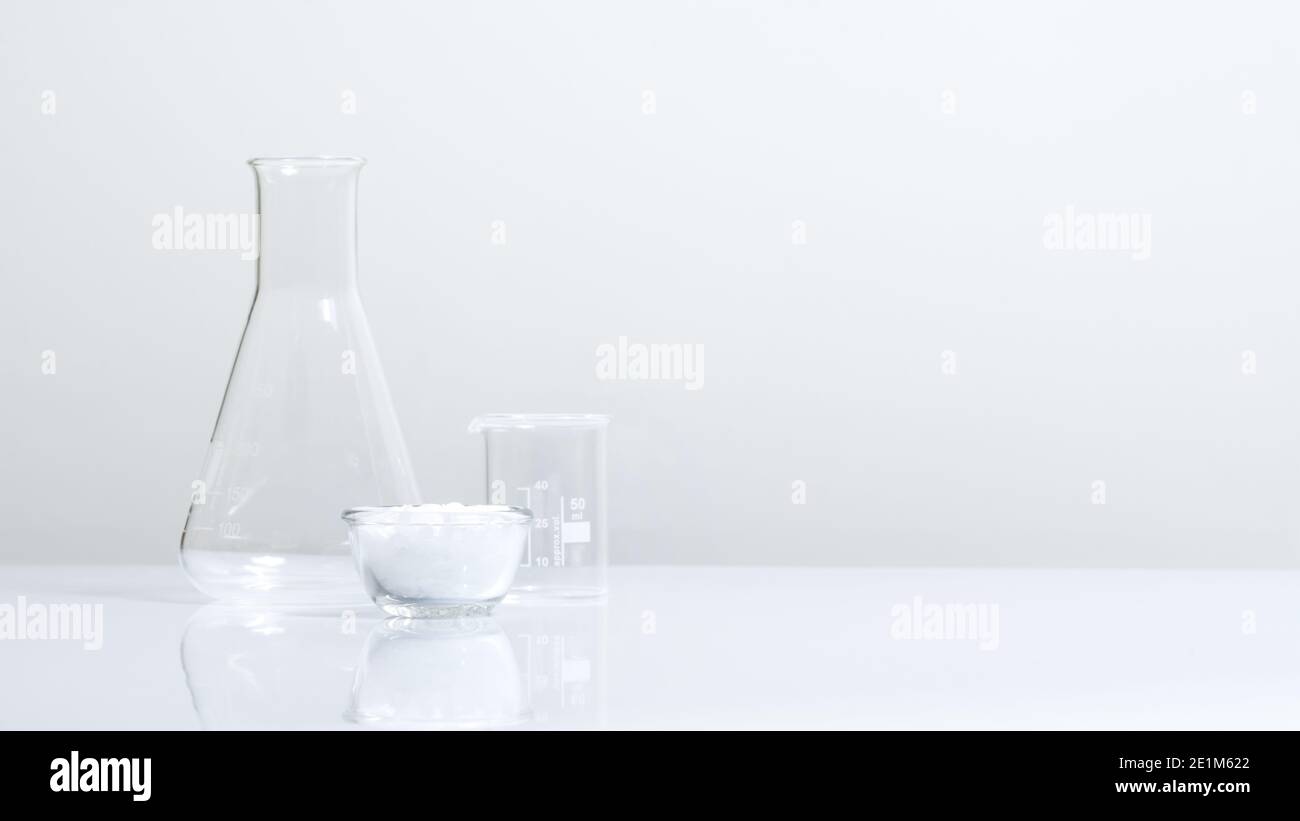 White flake chemical on laboratory table. Cetyl esters wax, Chemical ...