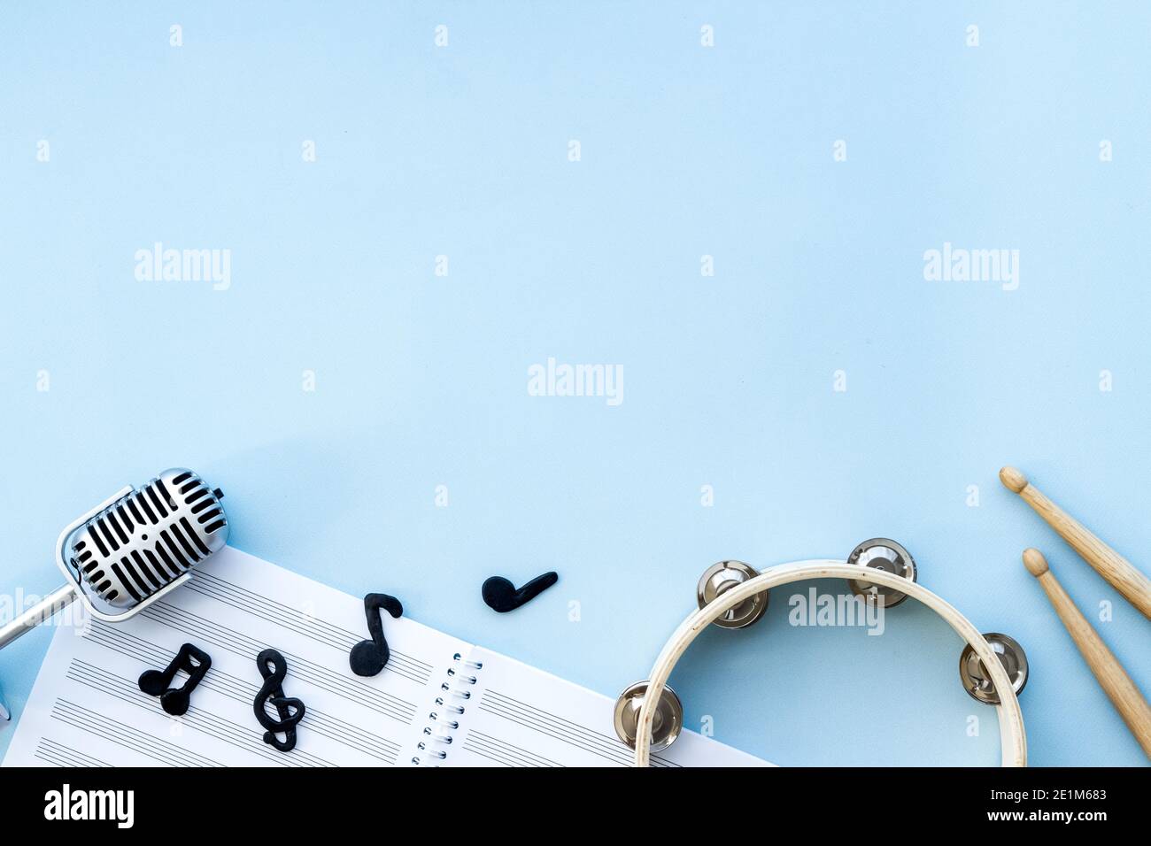 Flat lay of music background - instrument with sheet music, top view ...