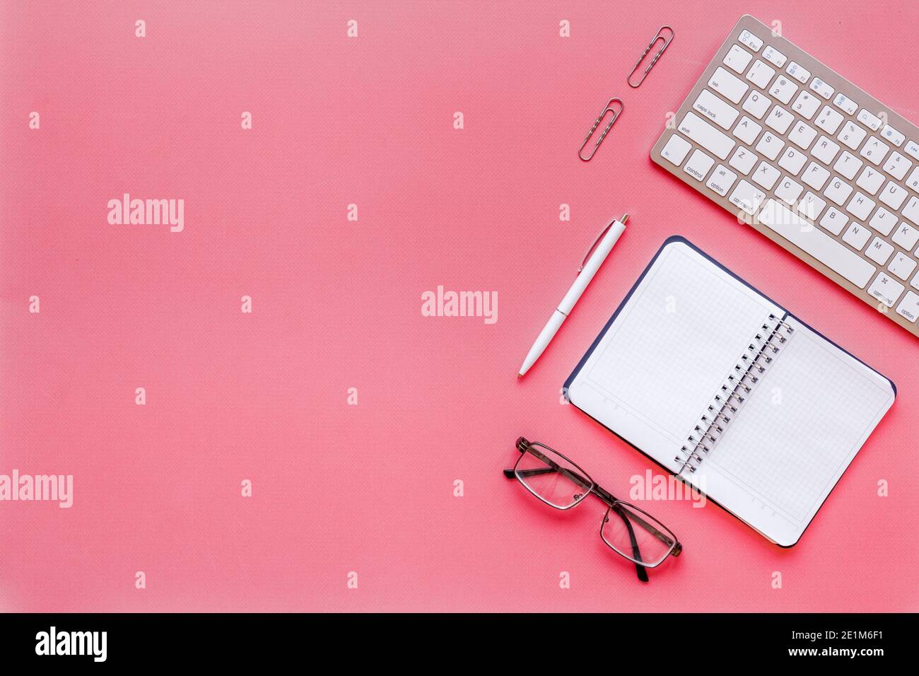 Pink flat lay top view office table desk with keyboard and office ...