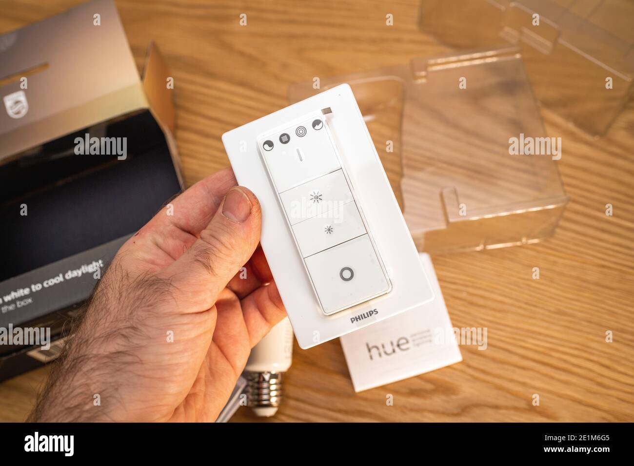 Paris, France - Dec 13, 2020: POV male hand unboxing unpacking new ...