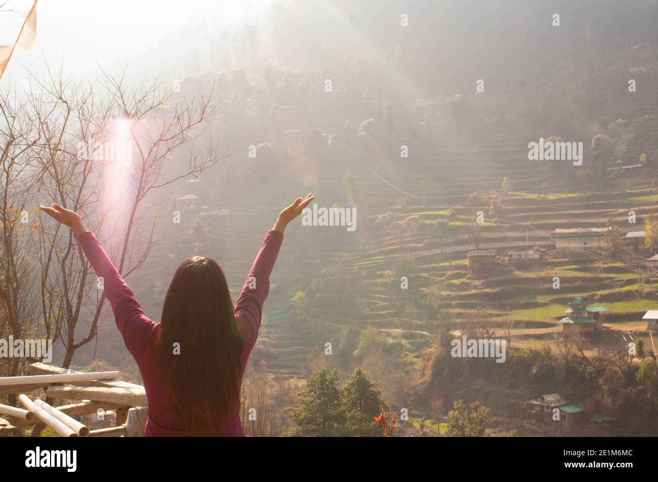 Photograph of a person extending the arms on the side of a hill Stock ...