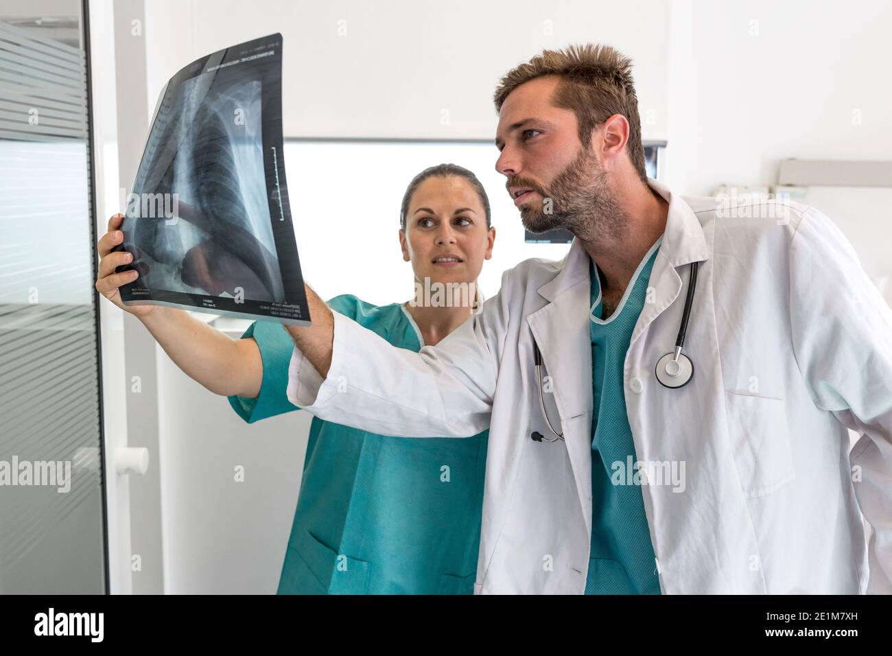doctor examining an x-ray at hospital Stock Photo - Alamy