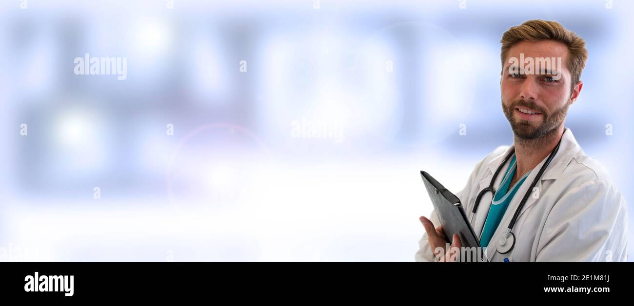 portrait of a young smiling doctor isolated on blurred medical ...