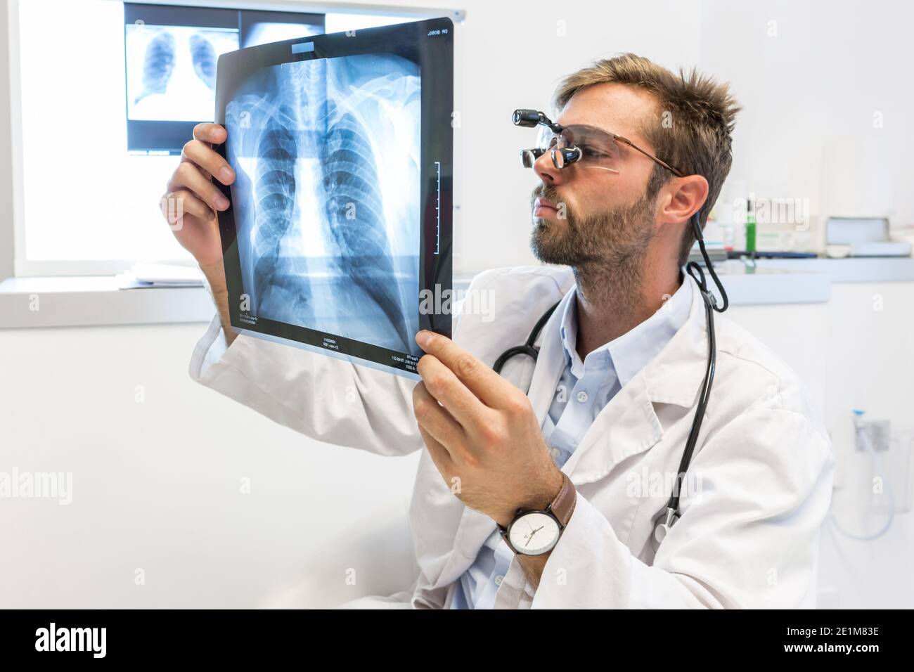 doctor examining an x-ray at hospital Stock Photo - Alamy