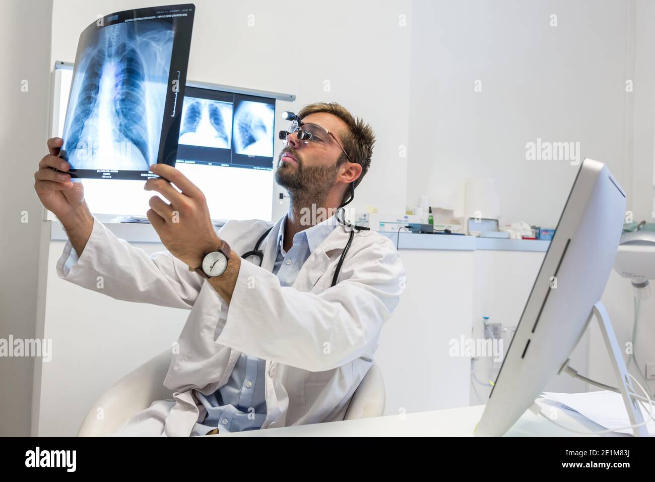 doctor examining an x-ray at hospital Stock Photo - Alamy