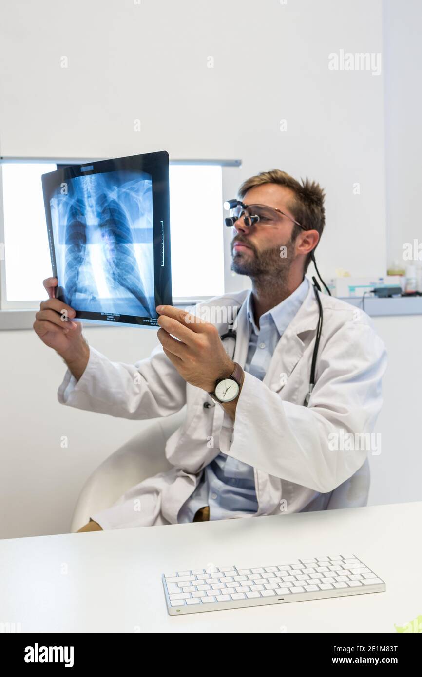 doctor examining an x-ray at hospital Stock Photo - Alamy