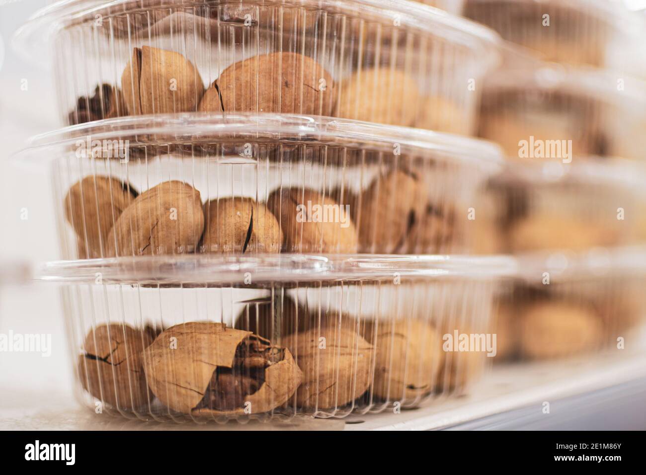 Pecans in shells in containers in a supermarket Stock Photo - Alamy